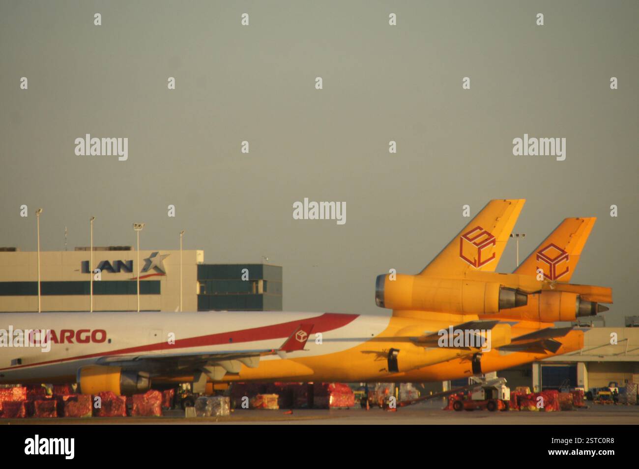 Two McDonnell Douglas MD-11F cargo jets parked on Miami airport tarmac ...