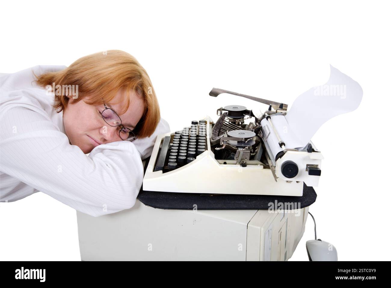 Woman sleeping on a workplace with a typewriter Stock Photo - Alamy