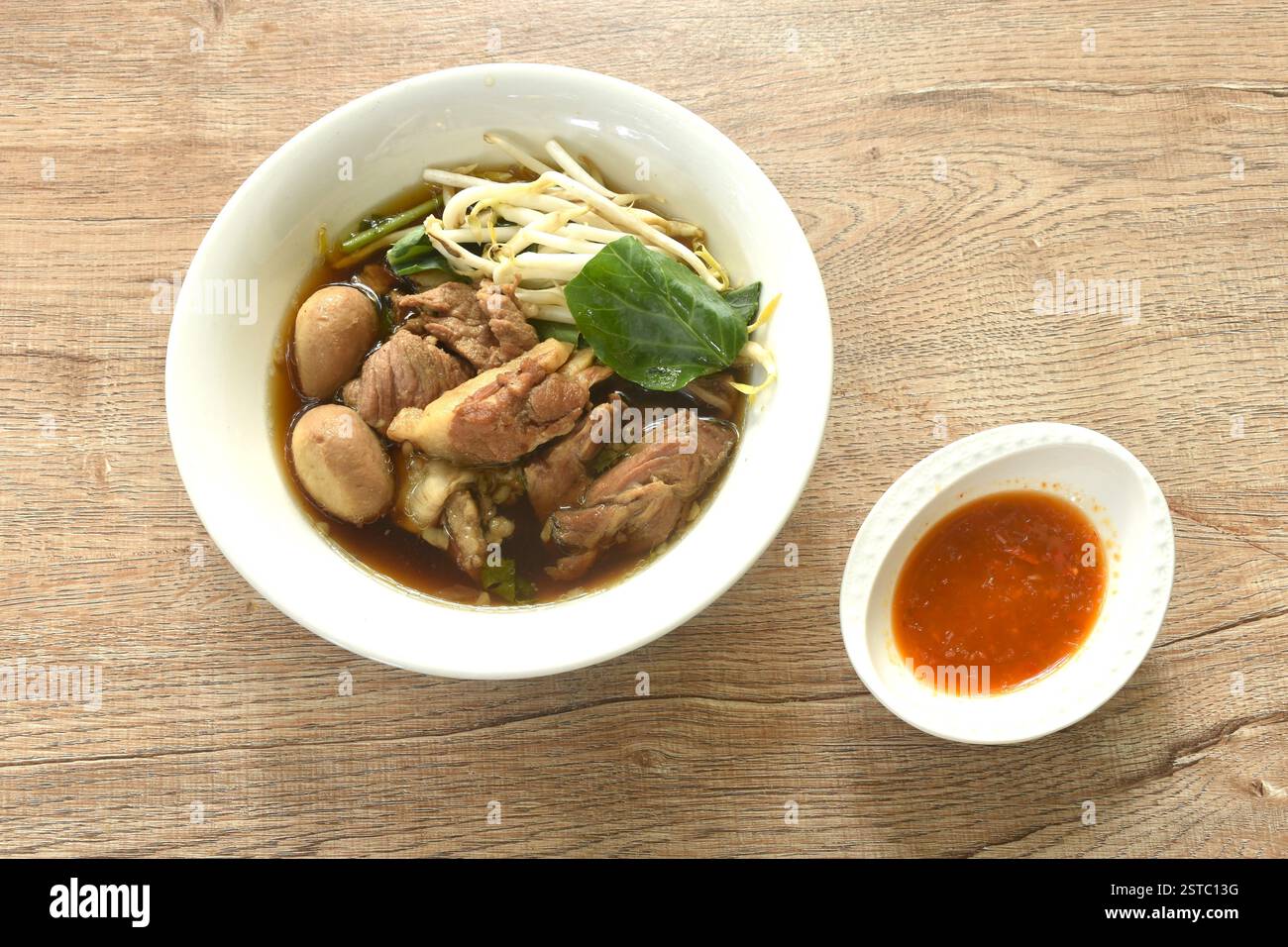boiled braised pork meat and tendon couple organ in herb brown soup on ...
