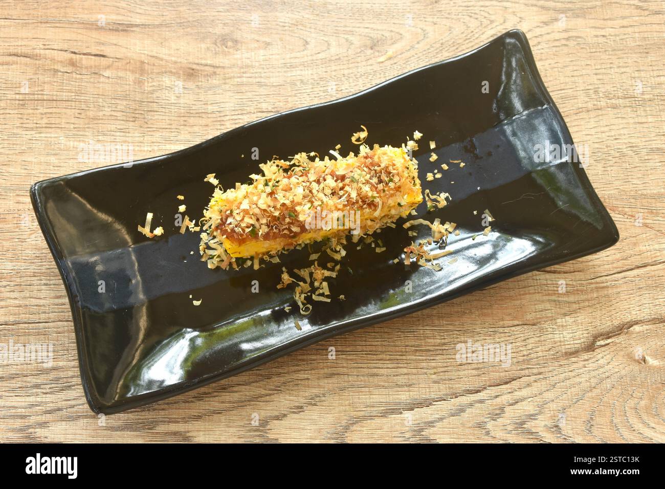 grilled Tamakoyaki or Japanese sweet egg roll omelet topping dry fish ...