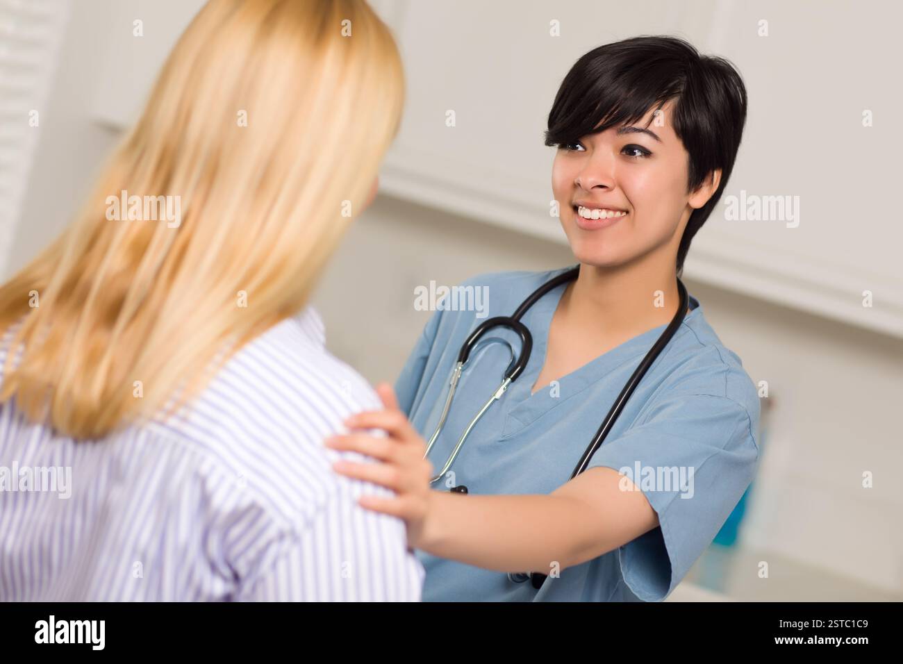Hispanic patient listening doctor talk hi-res stock photography and ...