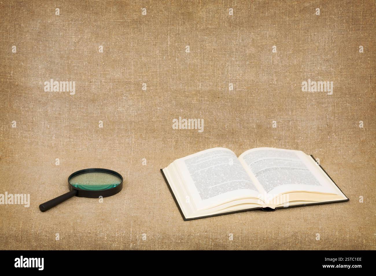 Open book magnifier hi-res stock photography and images - Alamy
