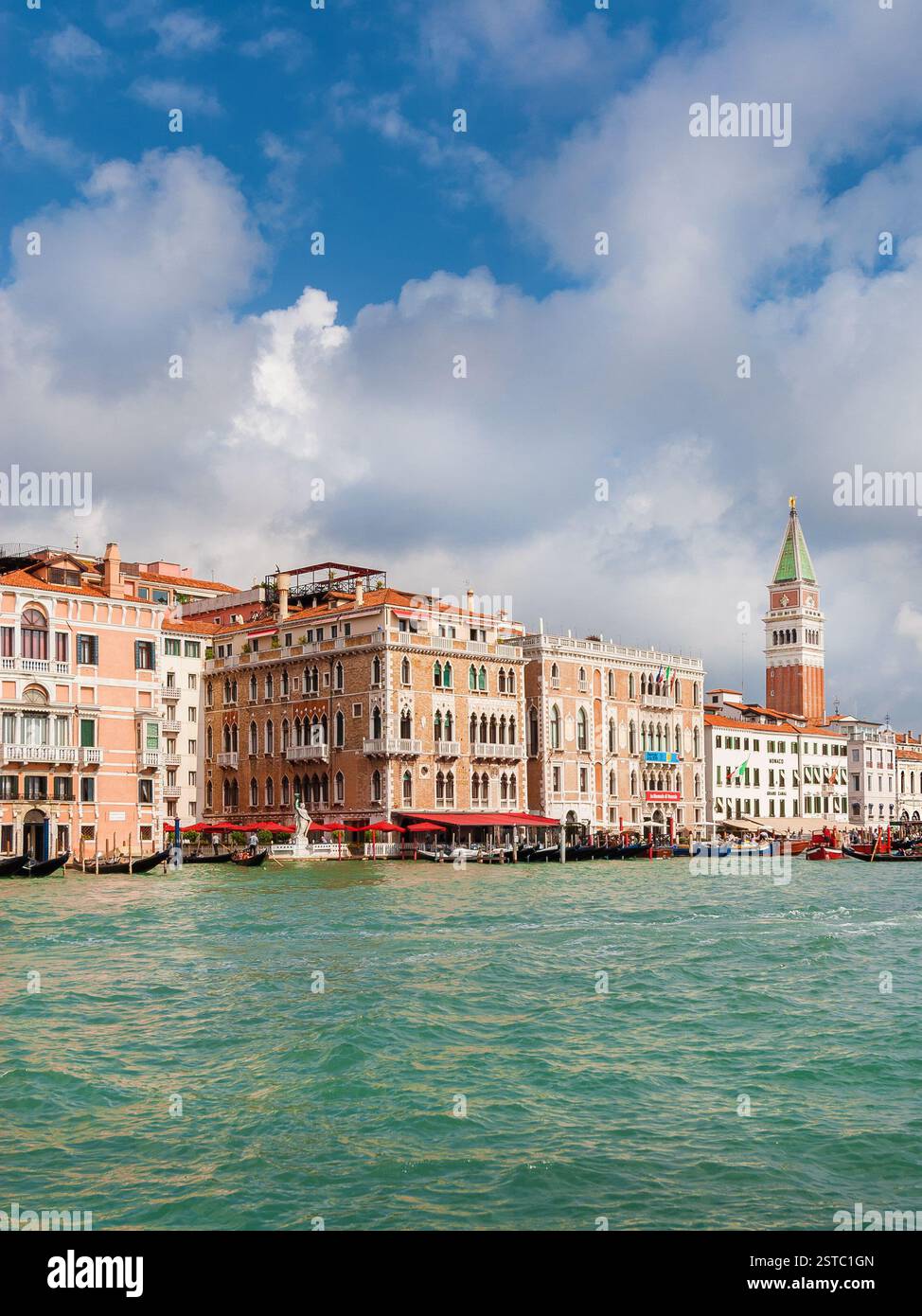 Tourism in Venice. City life along the famous Grand Canal with gondolas ...