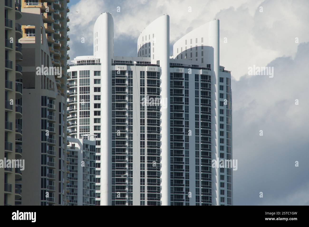 Miami. Skyscraper with reflective windows, cloudy sky. Tall building ...