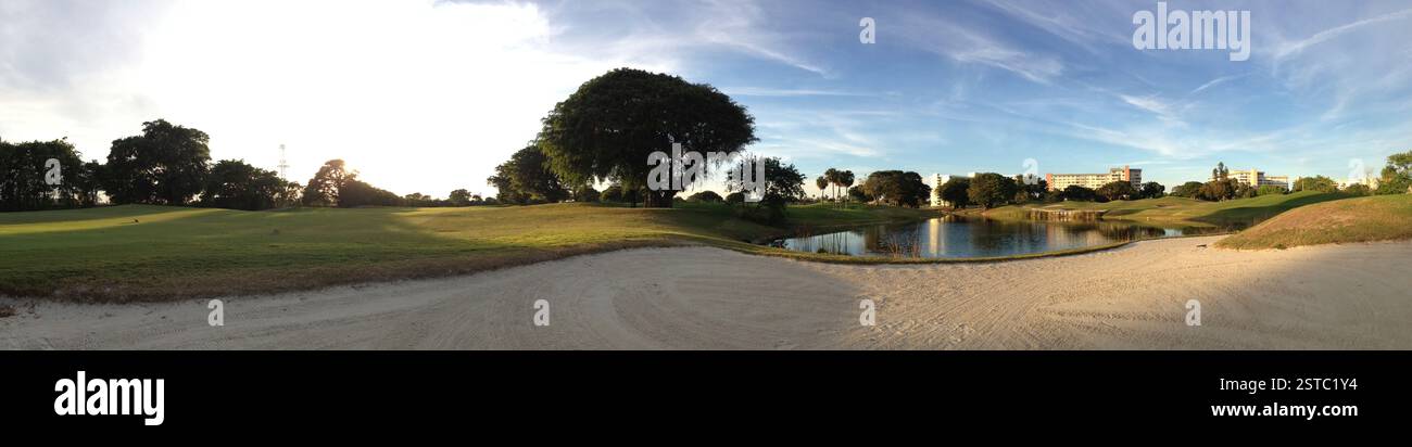 Panoramic view of a Miami golf club. Lush green fairways wind through ...