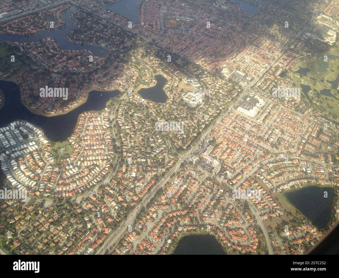 Aerial view of a suburban Miami neighborhood with colorful houses ...