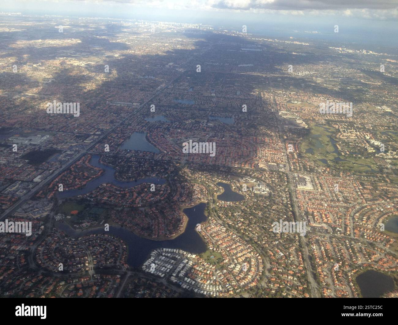 Aerial view Miami suburban neighborhood houses lakes winding streets ...