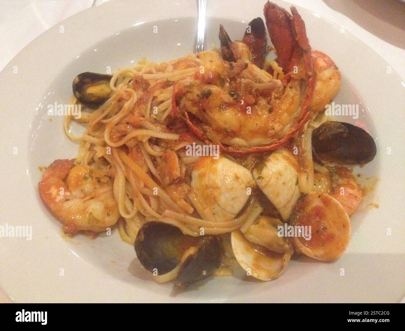 Delicious seafood pasta dish Miami. Steaming noodles plump shrimp ...