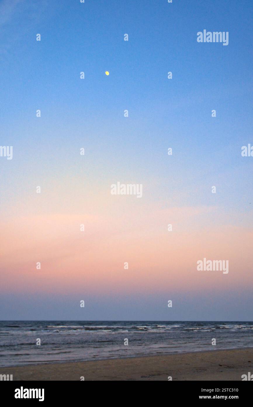 Moon in the sky in front of the beach on the island of Usedom on the ...