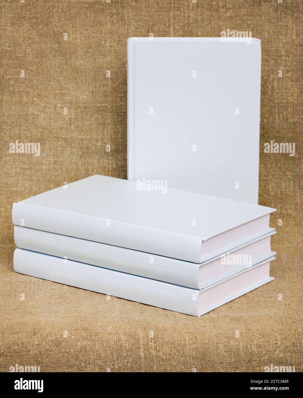 White books on the textile background Stock Photo - Alamy
