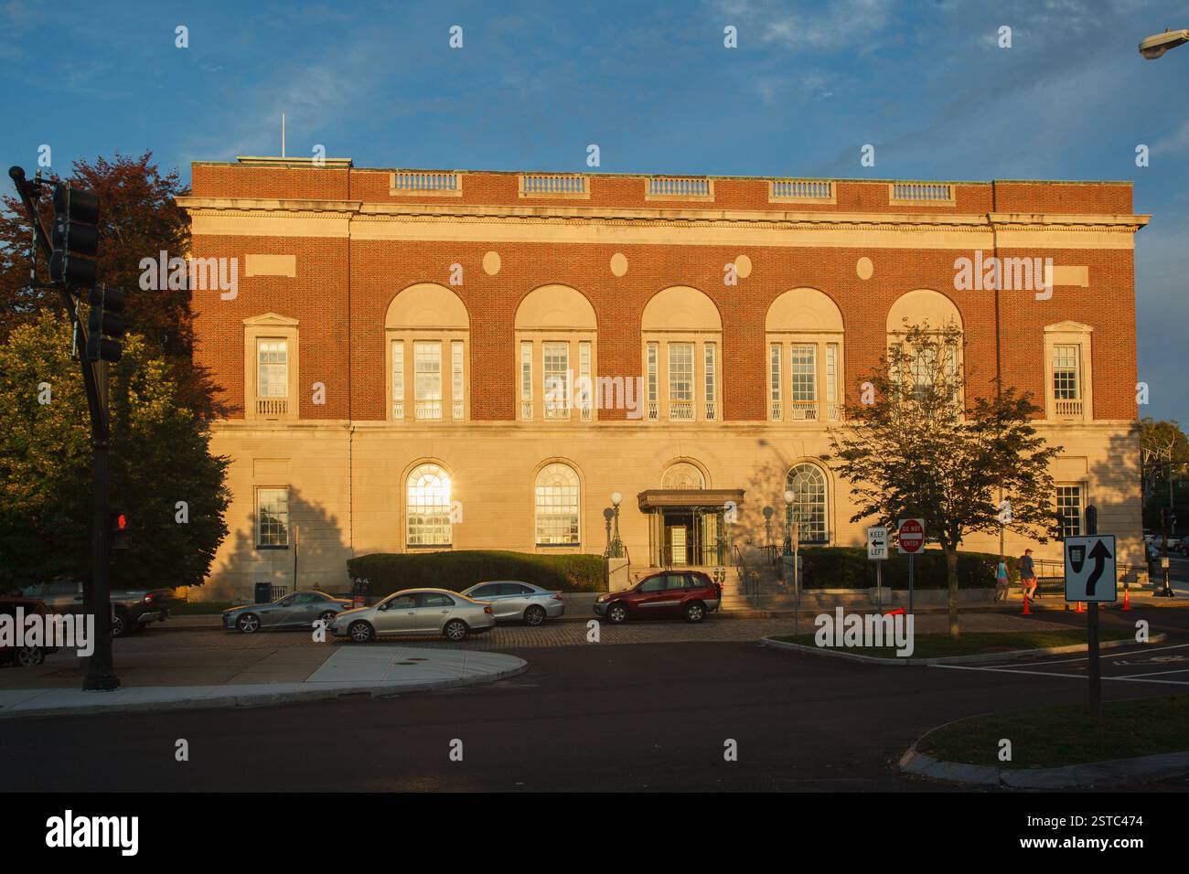 The facade of the Post Office historical brick building at sunset ...