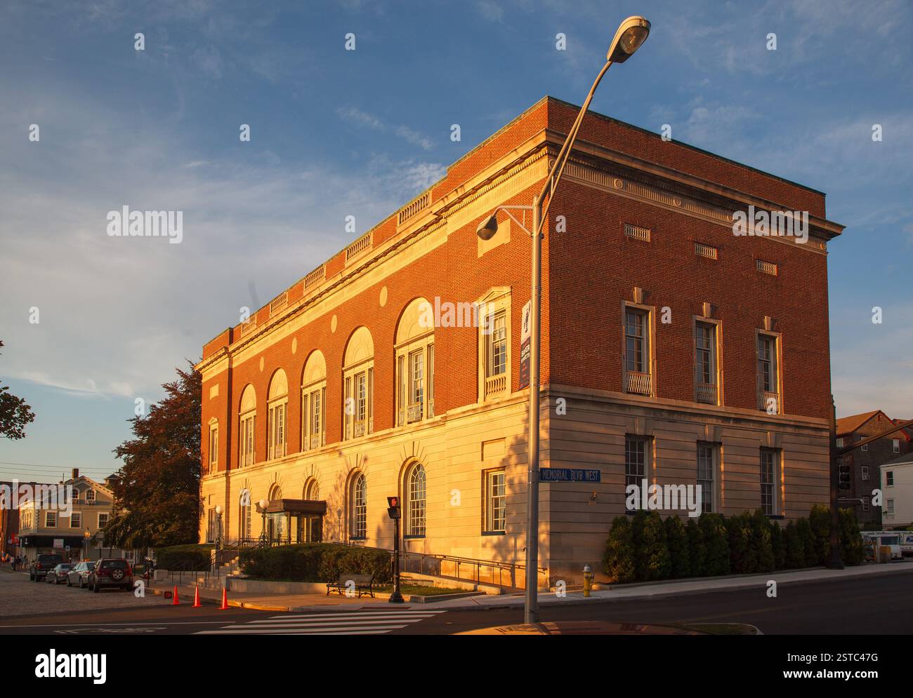 The facade of the Post Office historical brick building at sunset ...