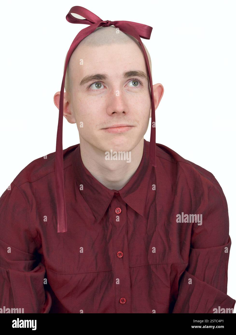 Young man with small bow on head Stock Photo - Alamy