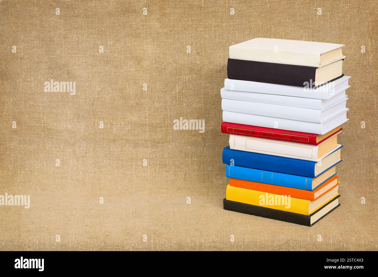 Pyramid from books on a canvas Stock Photo - Alamy
