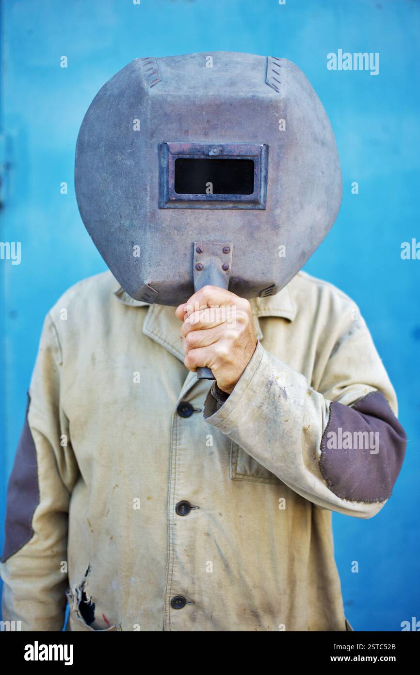 Builder - welder with old welding mask Stock Photo - Alamy