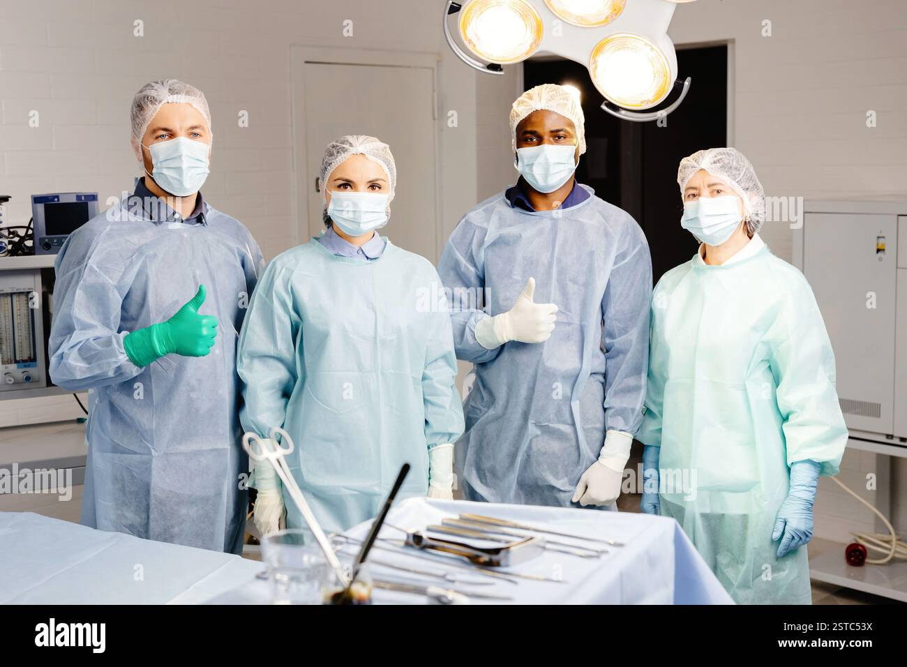 Group of doctors discussing patient cases around table Stock Photo - Alamy