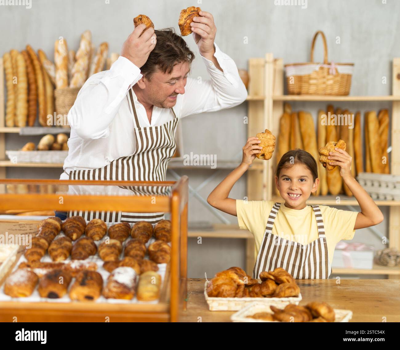 Uncle and girl are laughing, having fun, doing prank in trading floor ...