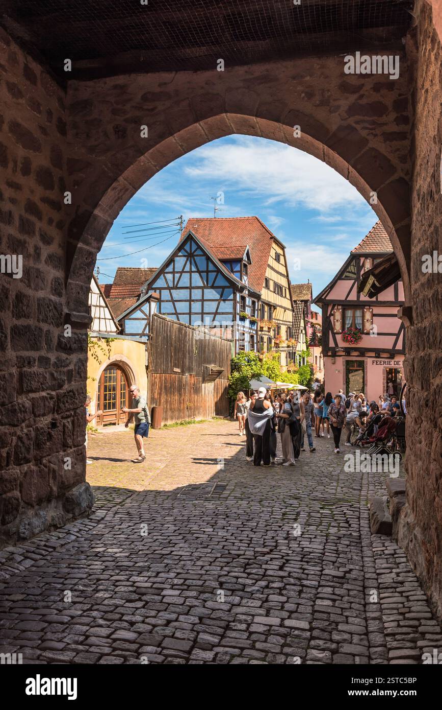 View through the gate tower (Dolder) into the old town of Riquewihr, a ...