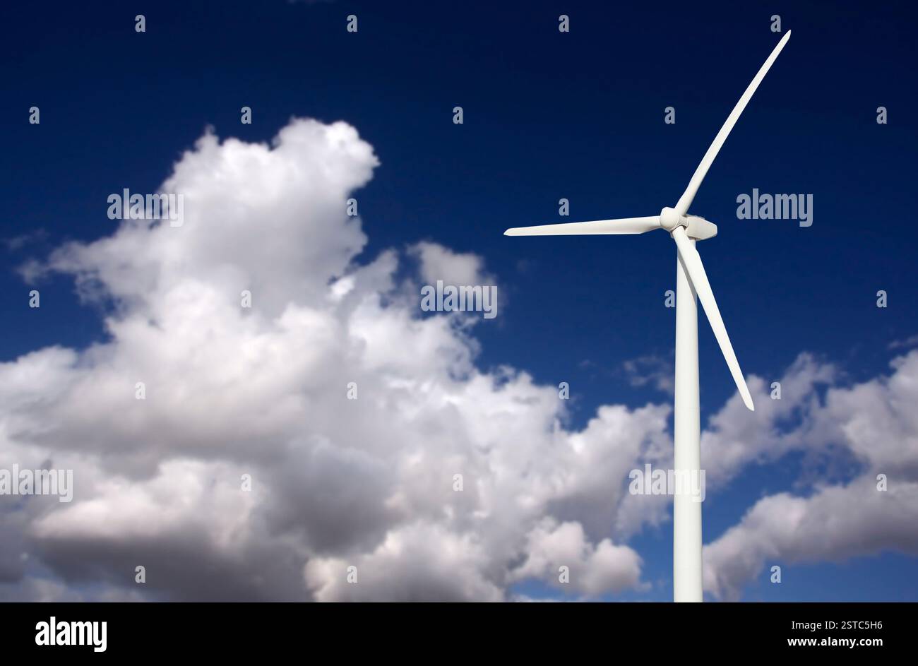 Single wind turbine over dramatic blue sky and clouds hi-res stock ...