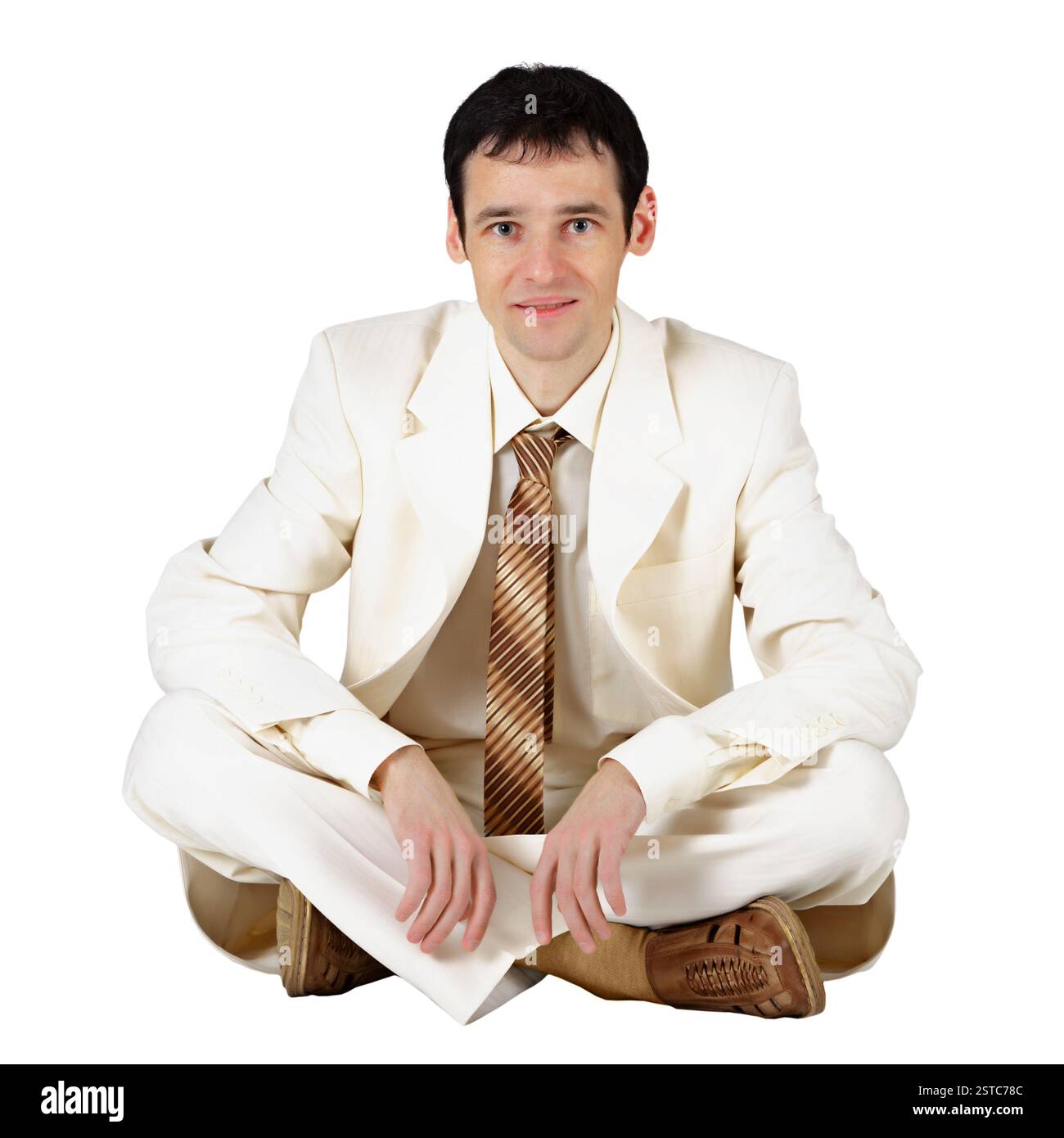 Business man sitting on a white Stock Photo - Alamy