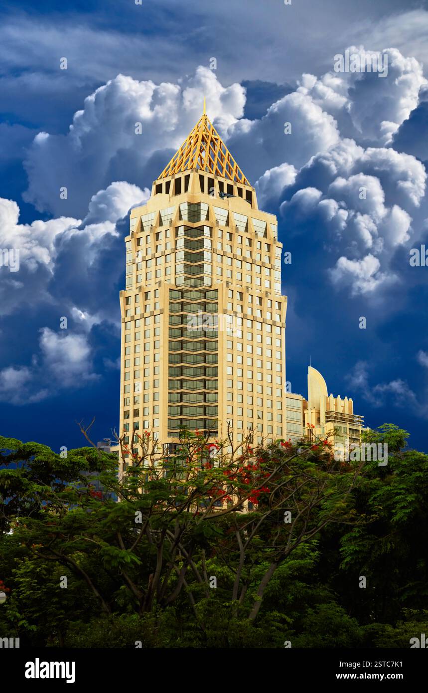 Golden skyscraper on blue sky background Stock Photo - Alamy