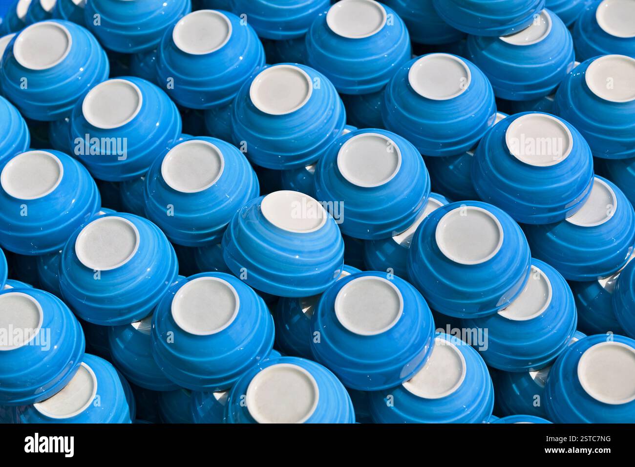 Blue ceramic cups - dishes on the market Stock Photo - Alamy