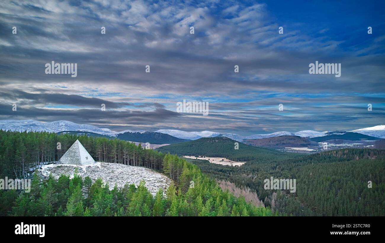 Prince Albert's Cairn snow covered pyramid cairn and hills Balmoral Estate Aberdeenshire ...