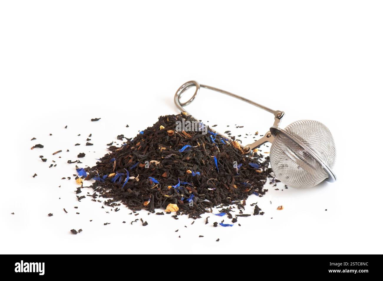Scented tea and tea ball on white background Stock Photo - Alamy