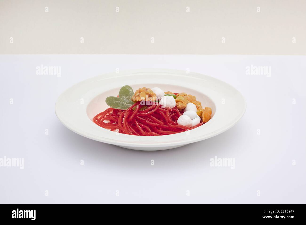 Candy pasta: red gummy strands, white candy balls, crunchy toppings ...