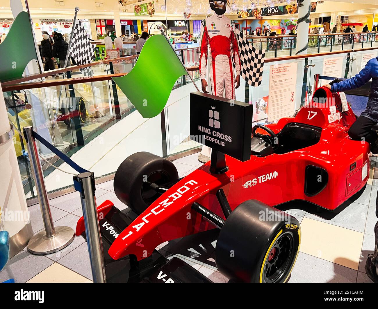 Lviv, Ukraine - February 16, 2025: Red racing car display with a ...