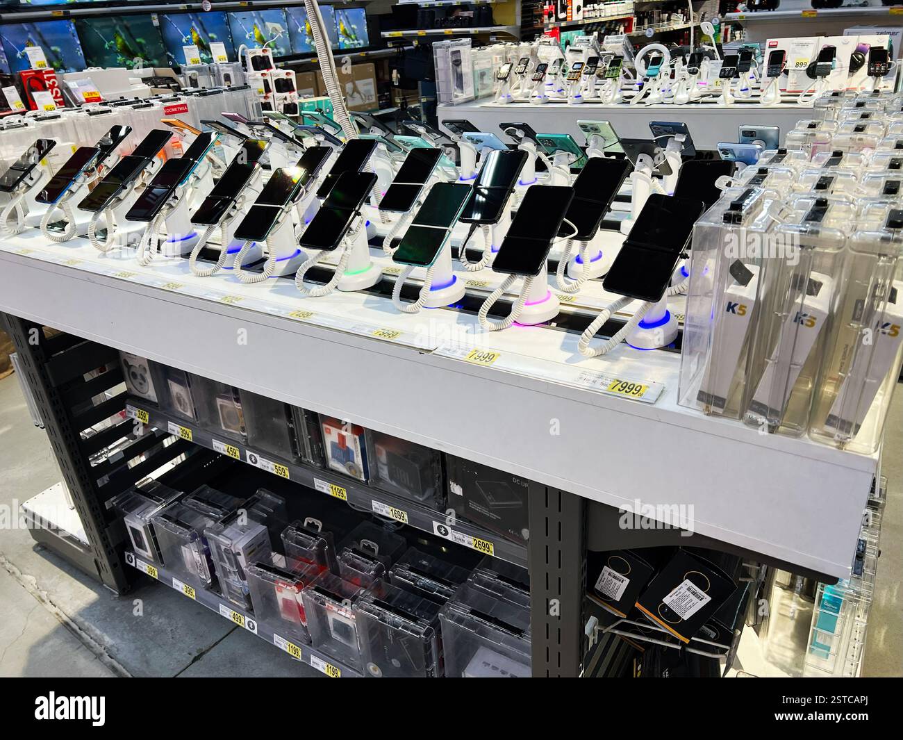 Lviv, Ukraine - February 16, 2025: Rich selection of smartphones and accessories on display in a ...