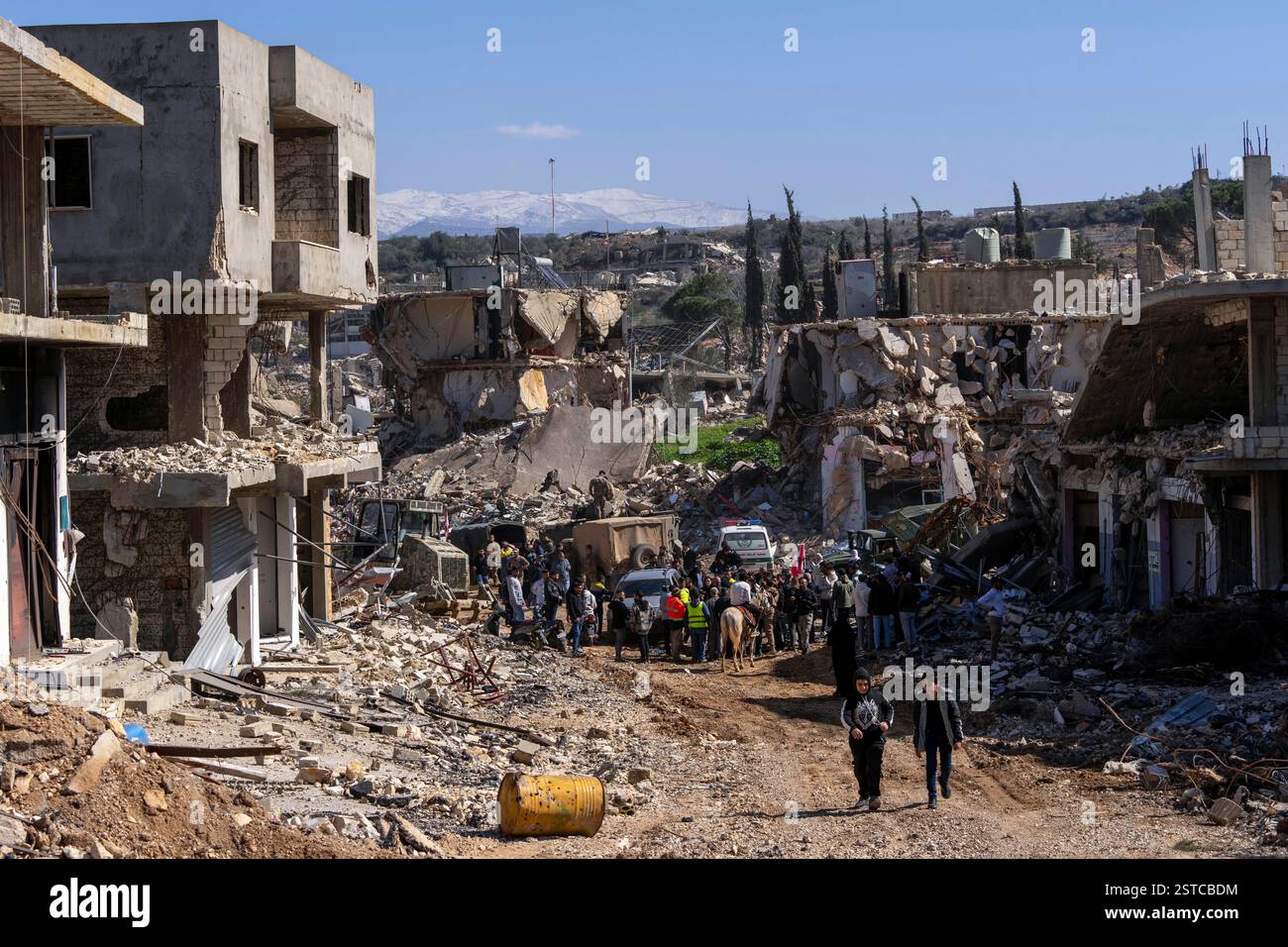 Lebanese gather after they entered their destroyed hometown of Kfar ...