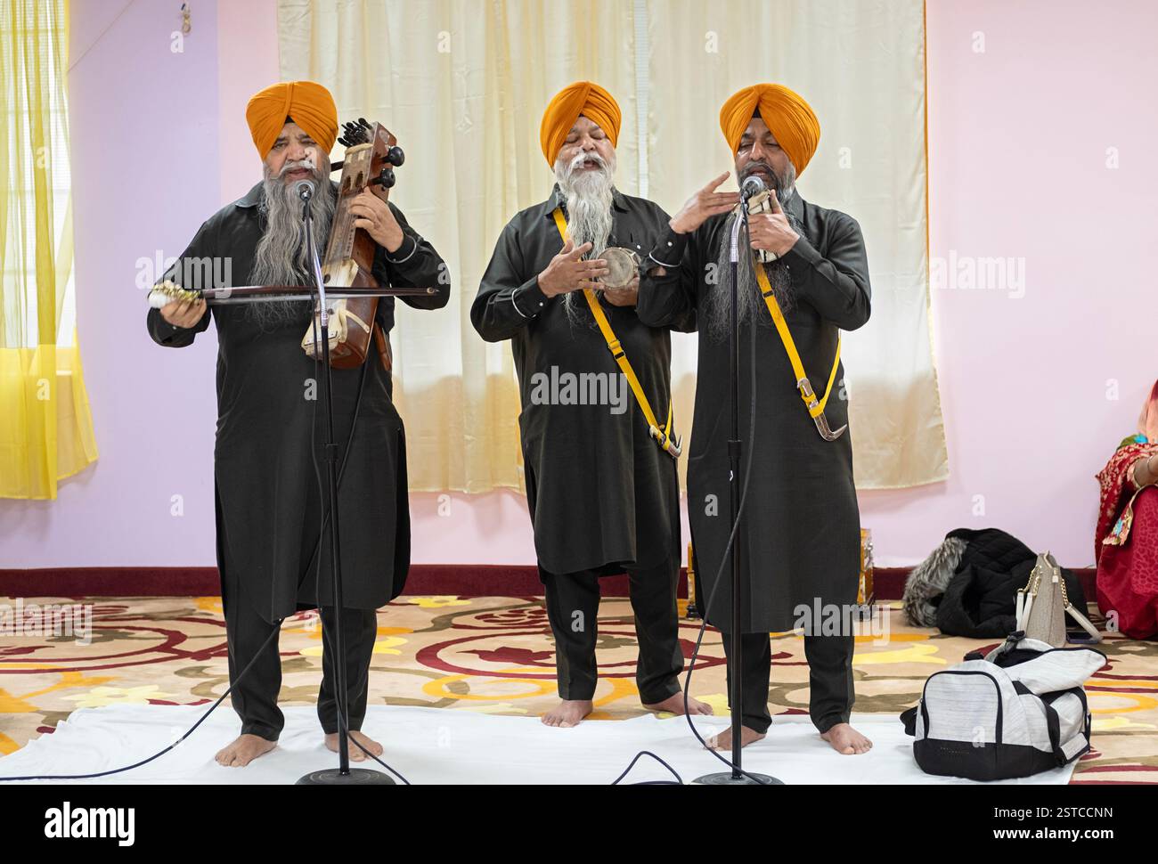 Musicians & priests perform kirtan devotional singing & chanting. In A ...