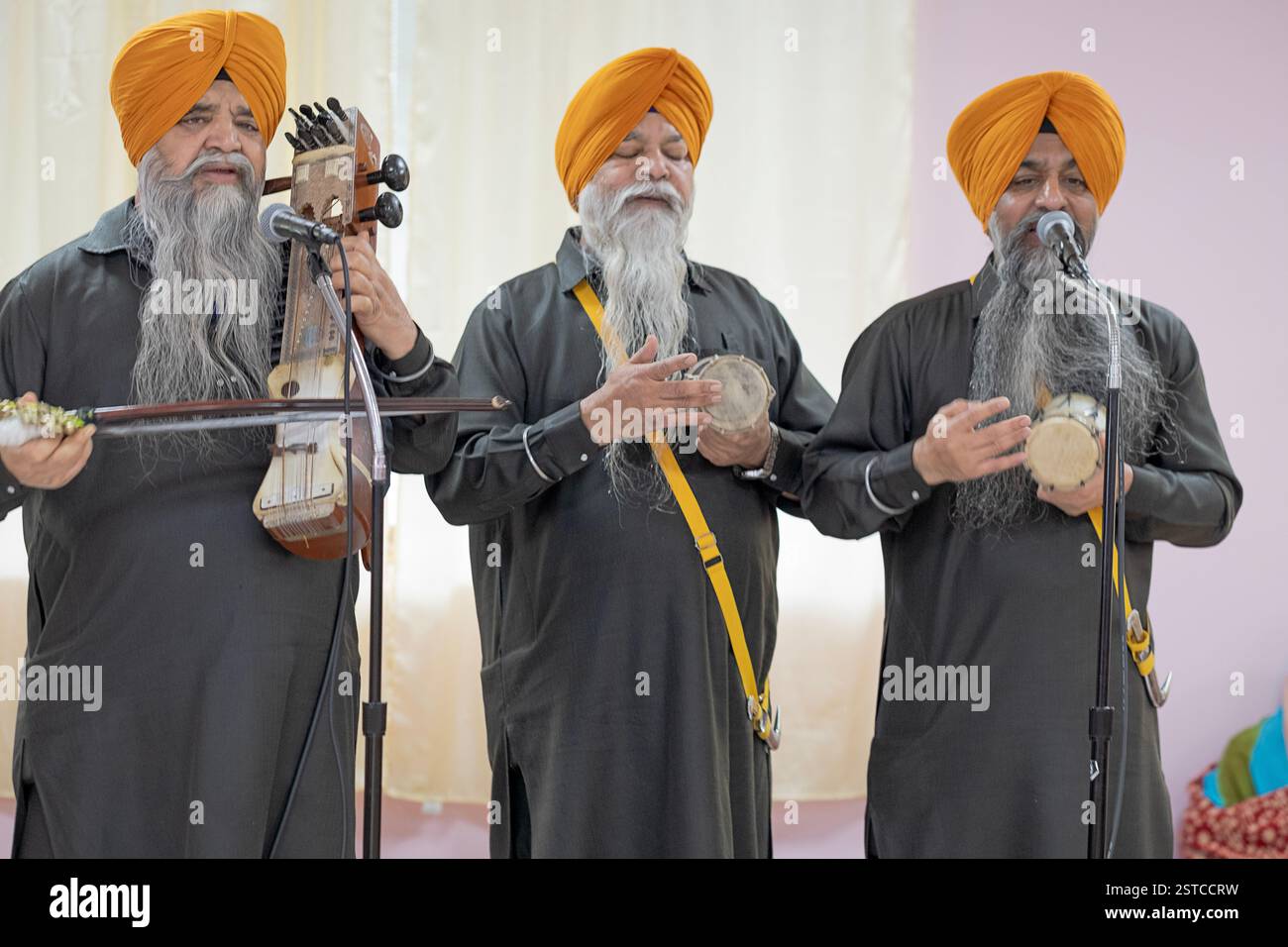 Musicians & priests perform kirtan devotional singing & chanting. In A ...