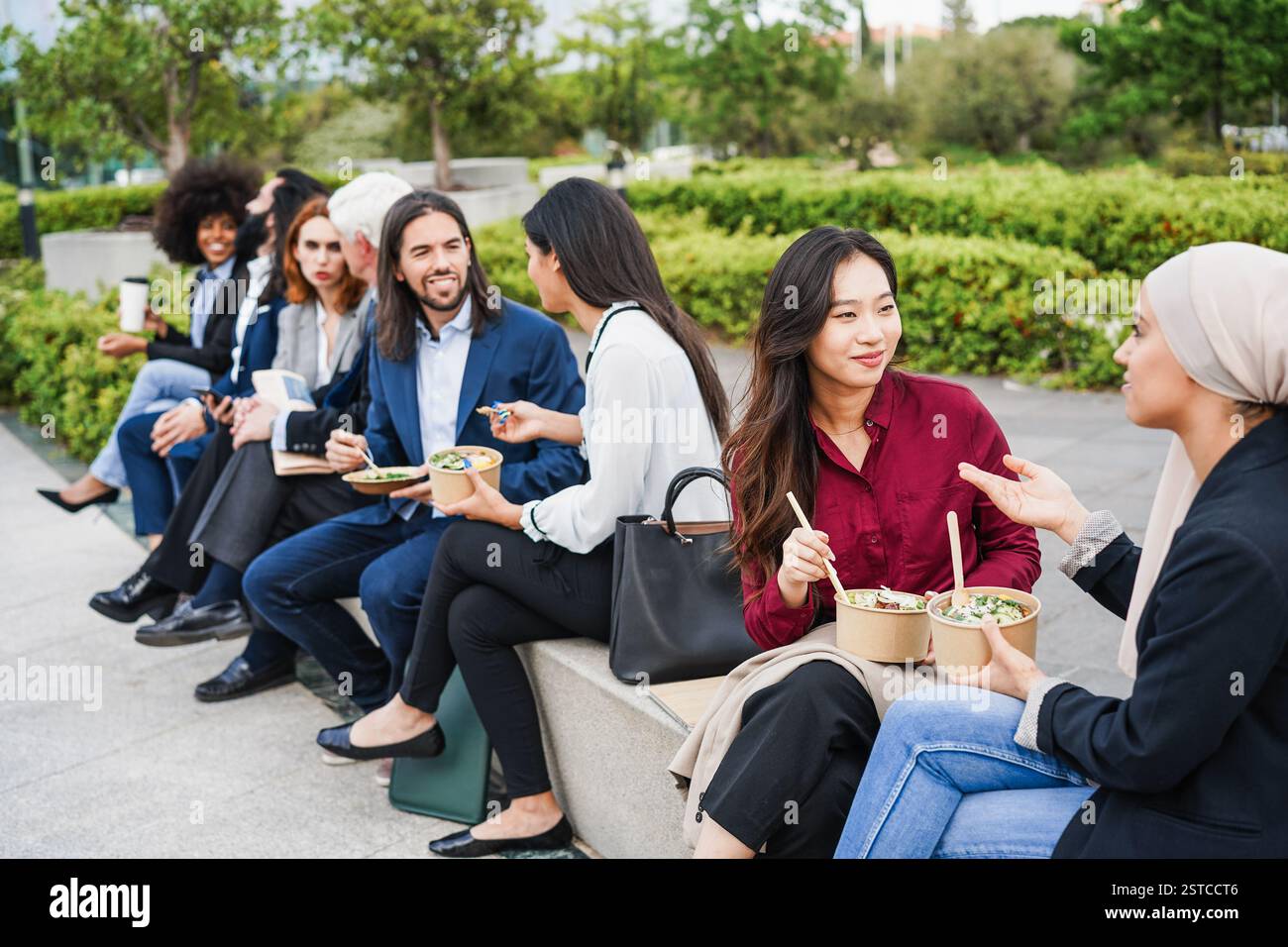 Business people doing lunch break with healthy food outdoor from office ...