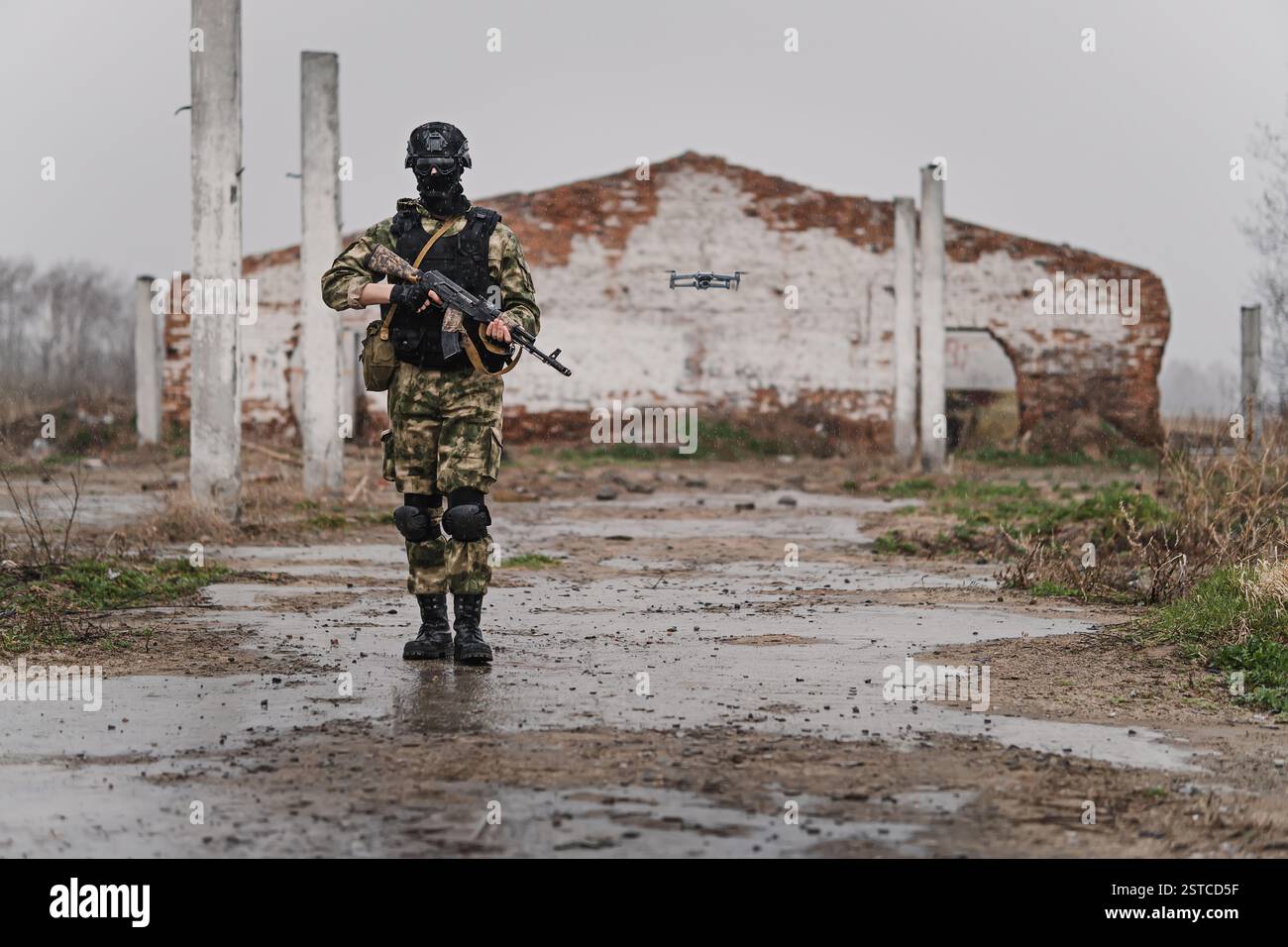 A special forces soldier with an automatic rifle wearing a helmet mask ...