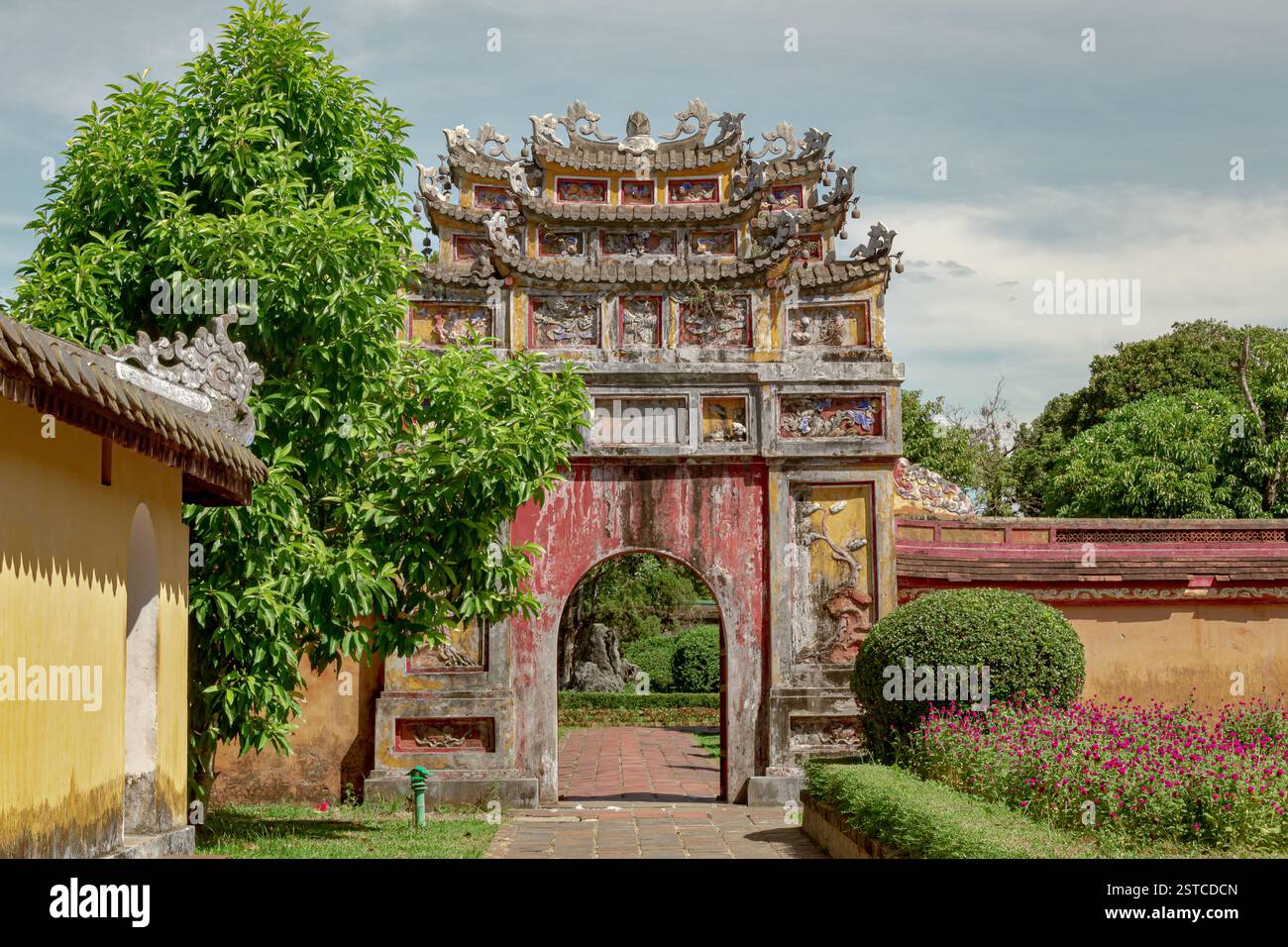 Colorful pink red stone gate design traditional architecture of the Hue ...