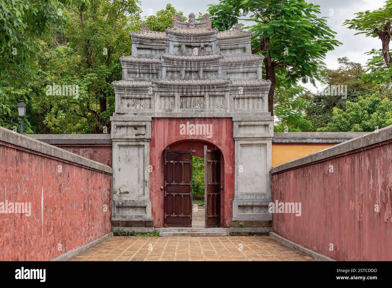 Colorful pink red stone gate design traditional architecture of the Hue ...