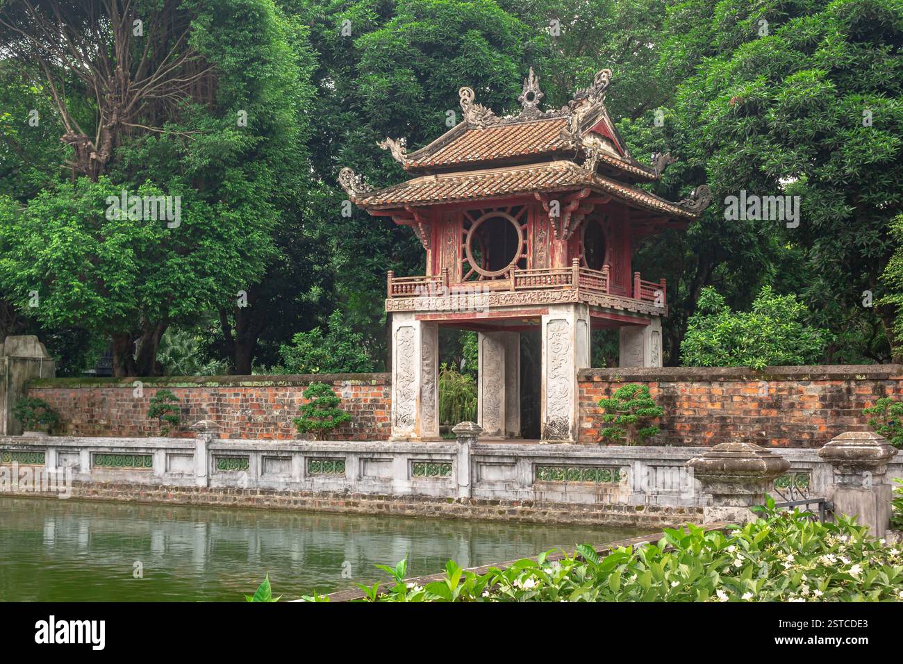 Colorful traditional tower pagoda structure and pond at the gardens of ...