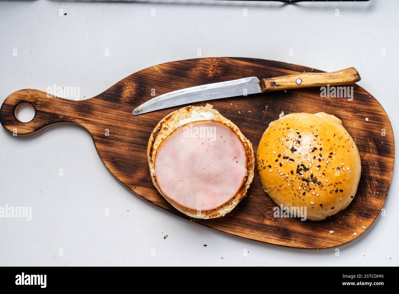 Sesame Bun Cut to Make Ham and Cheese Sandwich on Wooden Cutting Board ...