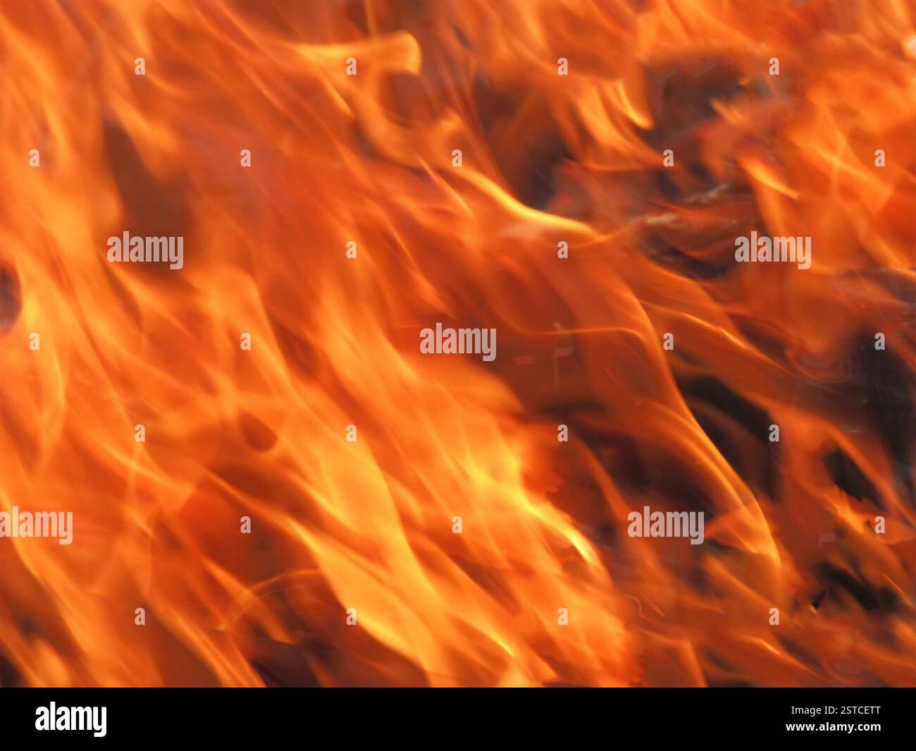 Burning red and yellow fire background Stock Photo - Alamy