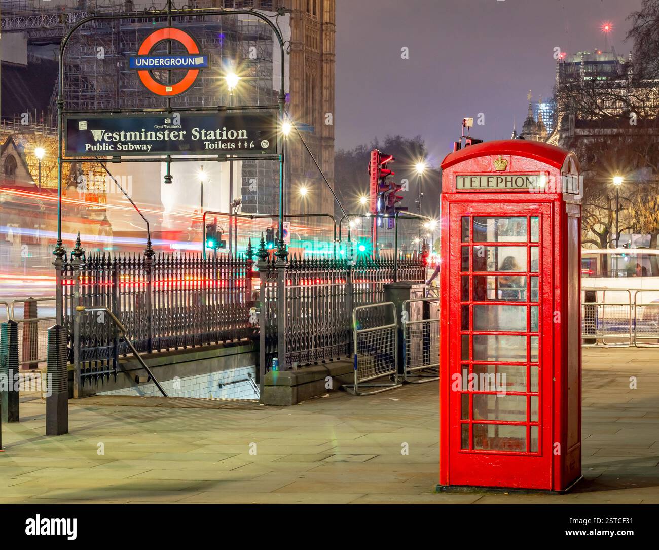 Red vintage London phone booth long exposure. Phone booth is situated ...
