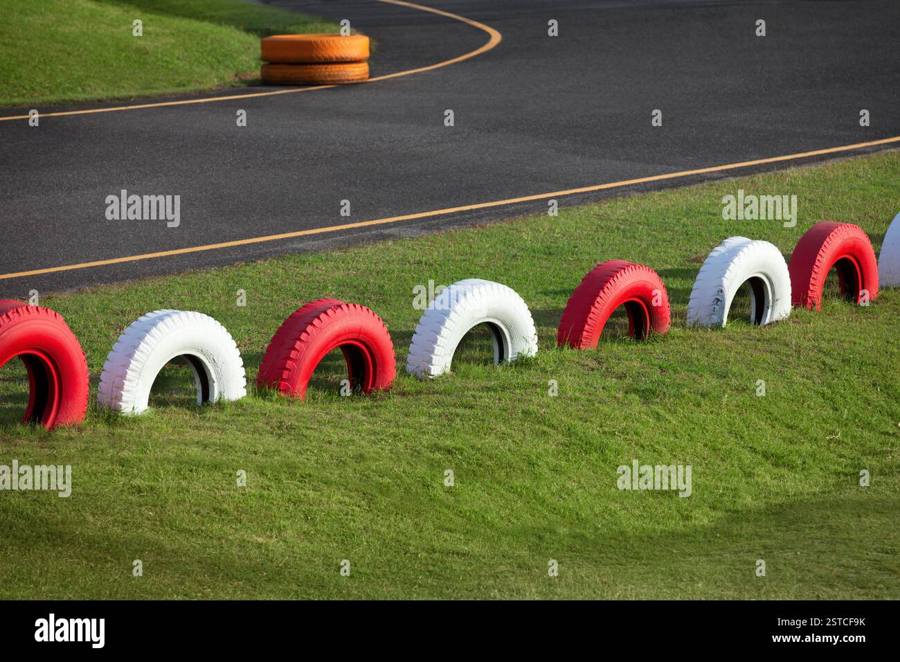 Racing track for karting with color wheels and grass Stock Photo - Alamy