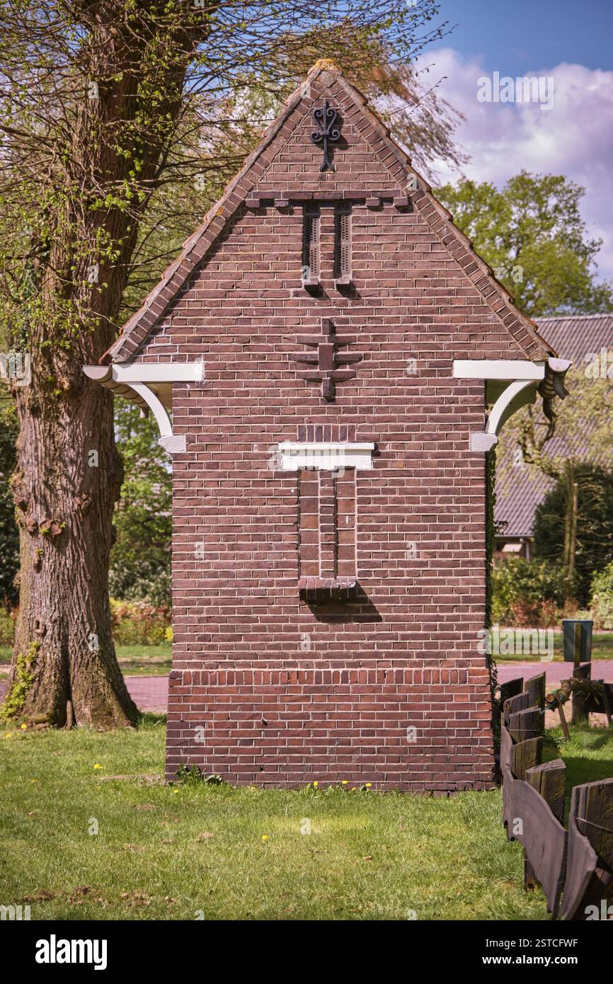 A traditional brick transformer house with a gable roof in Ees, Drenthe ...