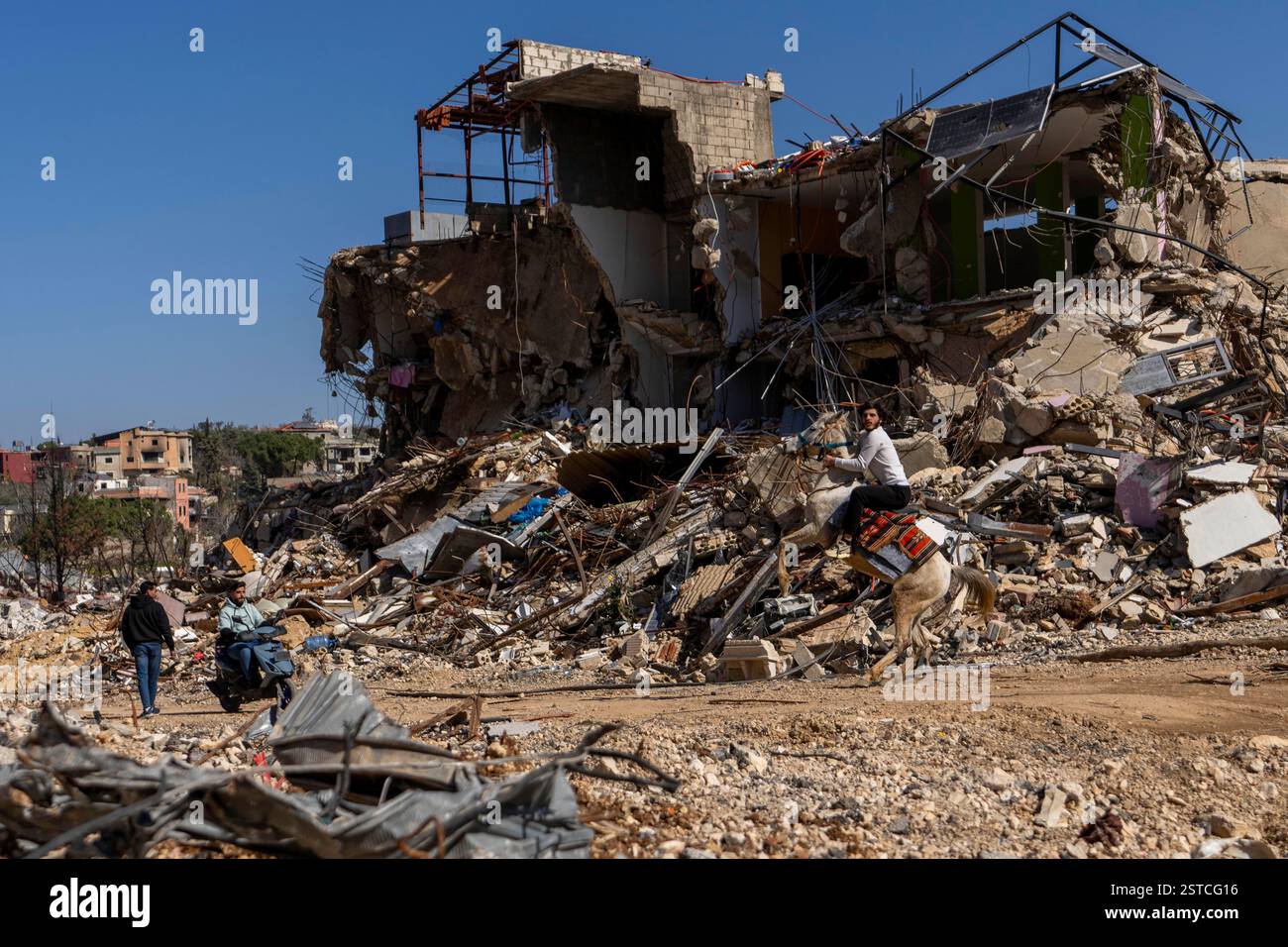 Lebanese citizens check the destruction in their village caused by the ...