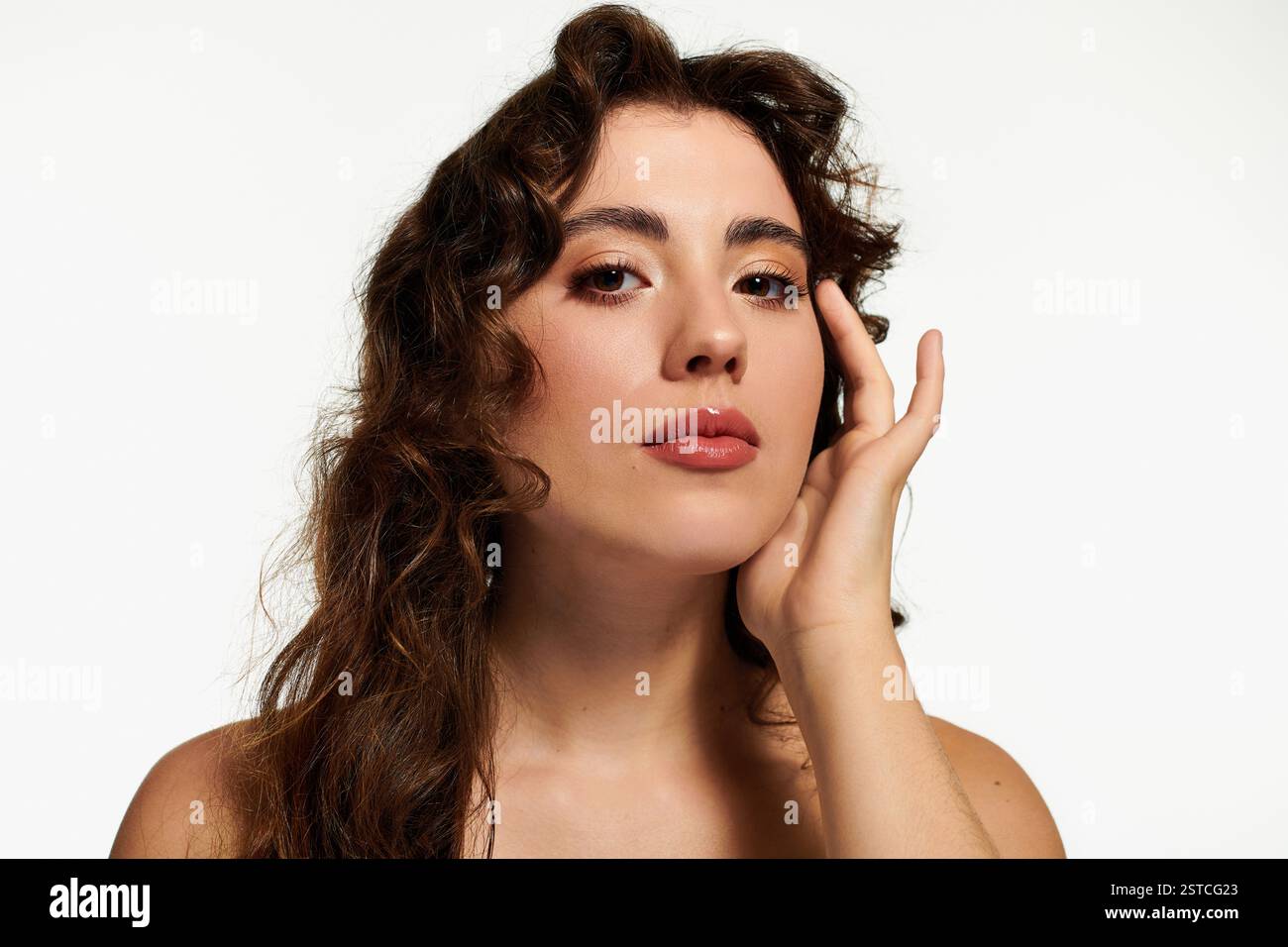Bright backdrop highlights the beauty and elegance of a young woman ...
