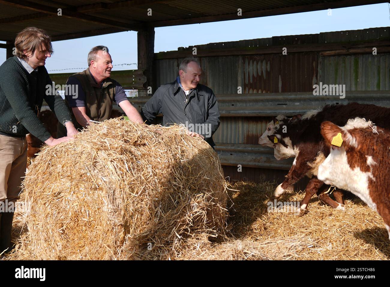 Liberal Democrats leader Sir Ed Davey with farmer Chris Blaxell (second ...