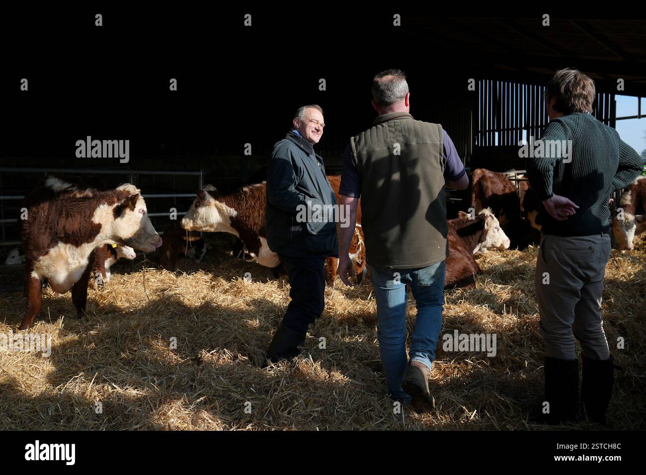 Liberal Democrats leader Sir Ed Davey with farmer Chris Blaxell (second ...