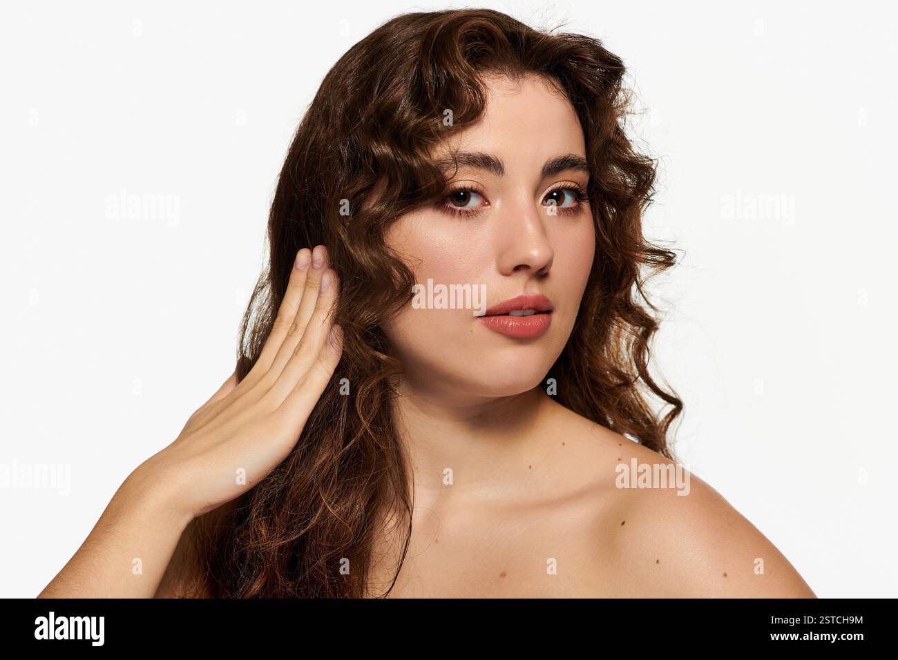 Confident young woman showcases her stylish look and beautiful curls in ...