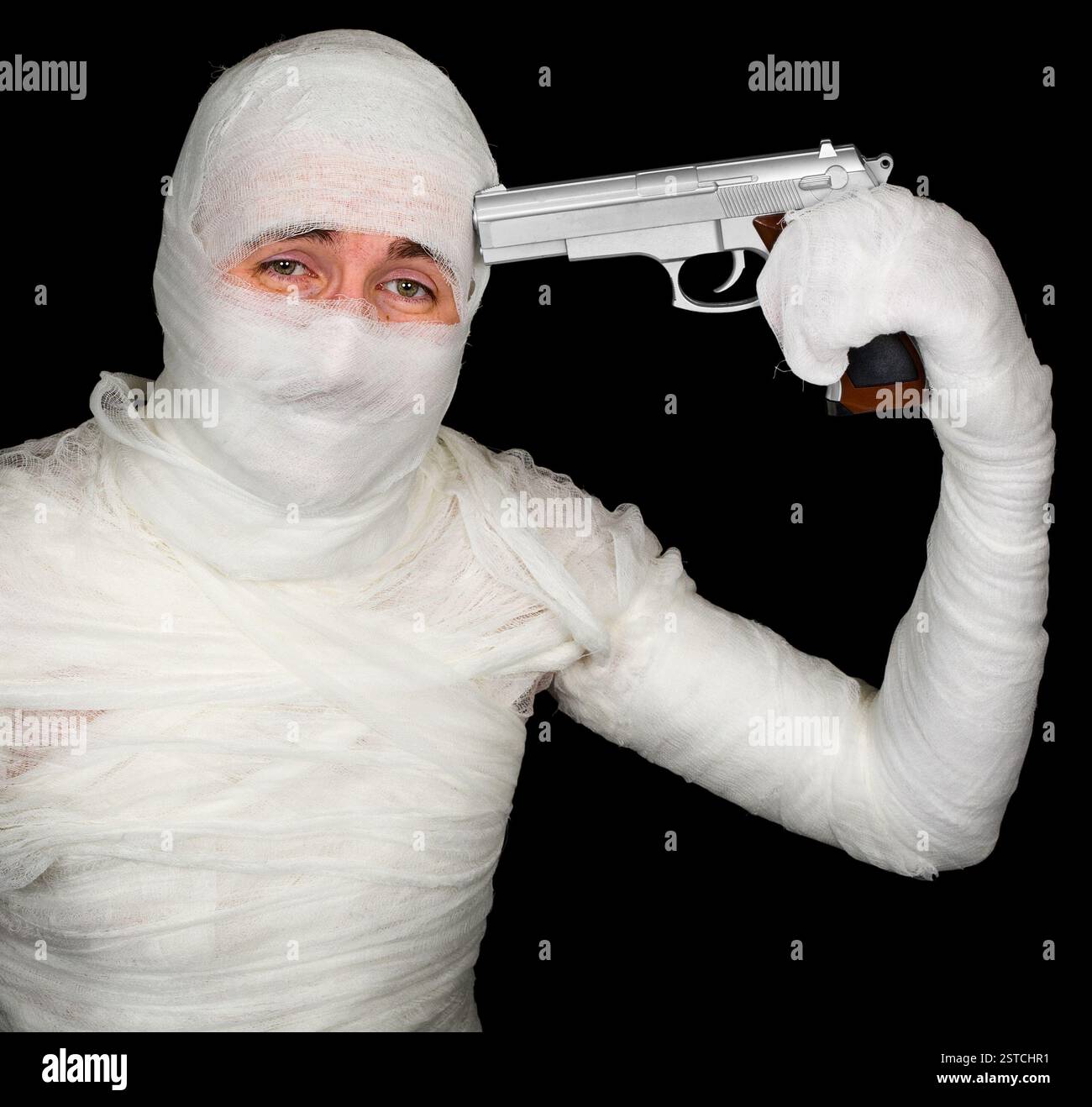 Completely bandaged man with gun - suicide Stock Photo - Alamy